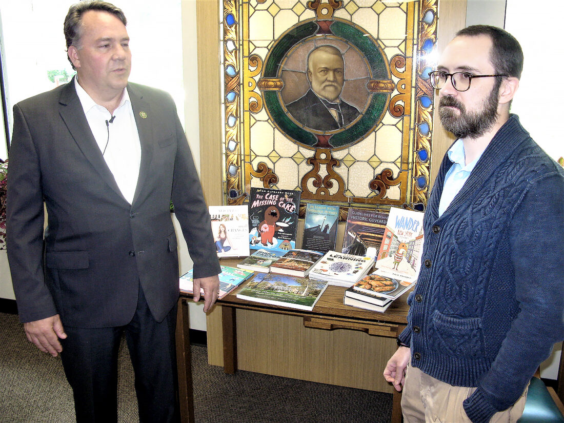 Mooney brings books to the library, says convictions would help Trump ...